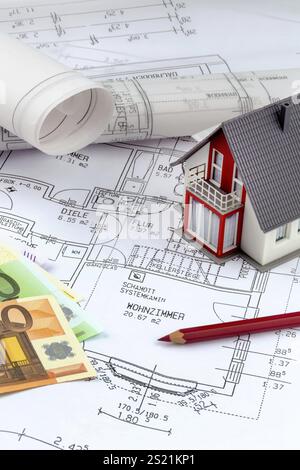 An architect's construction plan with euro money. Symbolic photo for ...