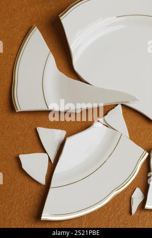 A broken plate lying on a floor Symbolic photo for divorce and ...