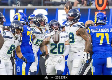 Seattle Seahawks safety Julian Love (20) stands on the field during an ...