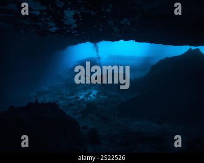 Sunlight illuminating the underwater cavern entrance in the sinkhole at ...