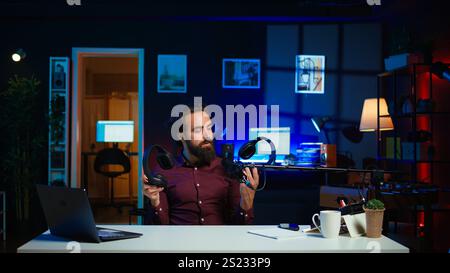 Tech expert testing headphones, review them for online streaming ...