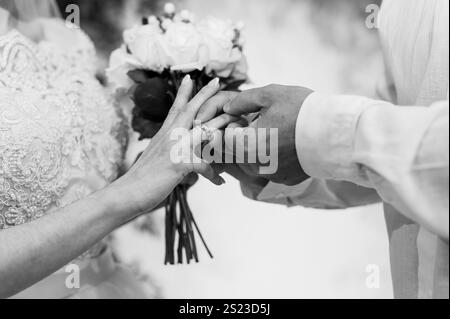 Intimate Moment of Ring Exchange Between Hands Stock Photo - Alamy