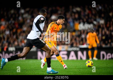 Real Madrid's Jude Bellingham, top second from right, heads the ball on ...