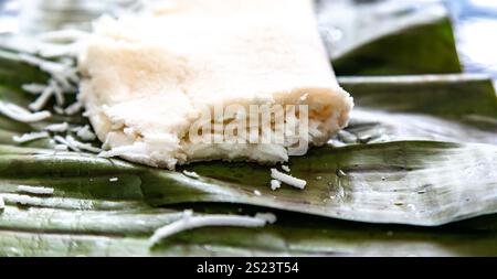 Traditional Brazilian tapioca with coconut served on a banana leaf ...