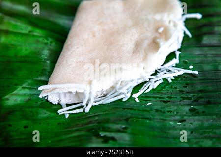 Traditional Brazilian tapioca with coconut served on a banana leaf ...