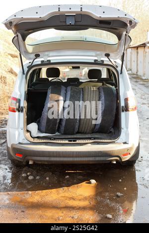 seasonal tire replacement - set of tires in boot of car Stock Photo - Alamy