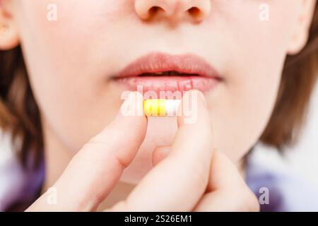 patient takes pill close up isolated on white background Stock Photo ...