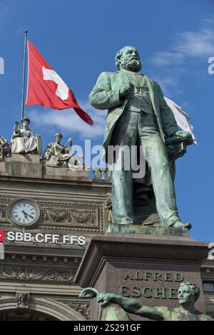 Swiss flag behind monument to Alfred Escher, Swiss politician, business ...