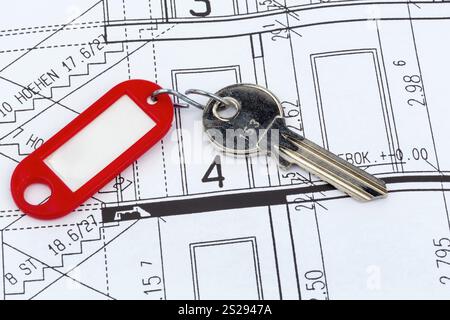An architect's construction plan with the key to a flat or a new house ...