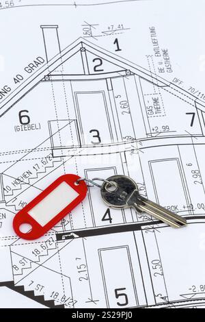 An architect's construction plan with the key to a flat or a new house ...
