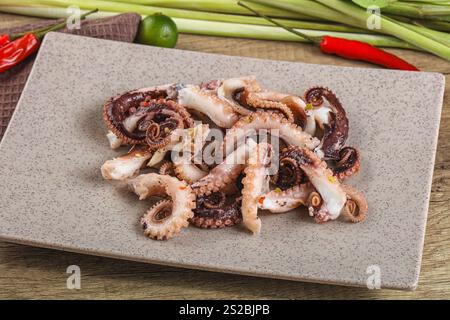 Grilled octopus red tentacle sliced appetizer Stock Photo - Alamy