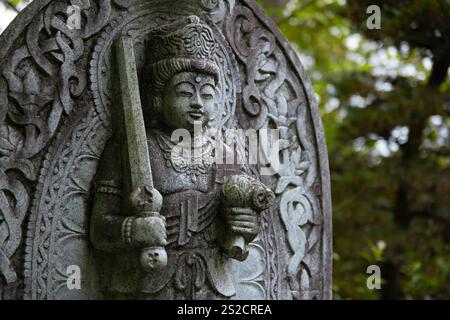 A religious stone statue of Akasagarbha at Japanese buddhism temple ...