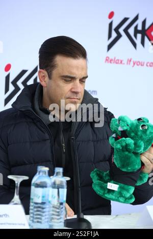 Robbie Williams poses during the "Top of the Mountain Concert" in ...