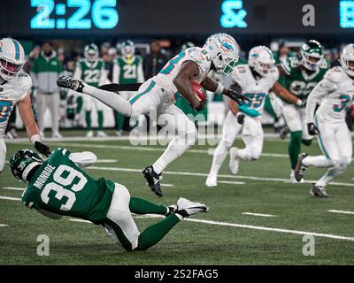 New York Jets' Jarius Monroe stops Green Bay Packers' Cornelius Johnson ...
