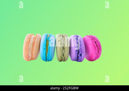 colorful macaroni on pink gradient background Stock Photo - Alamy