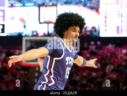 TCU forward David Punch (15) puts up a shot over Iowa State center ...