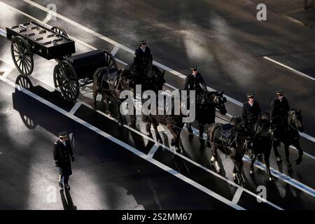 A horse-drawn caisson awaits the arrival of former President Jimmy ...