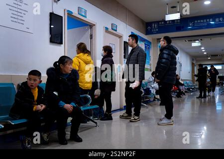 CHONGQING, CHINA - JANUARY 7, 2025 - Parents with their children ...