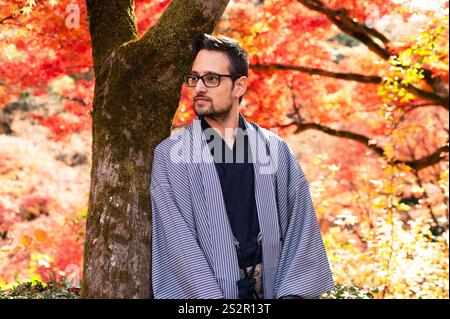 Japanese man in vibrant red wig and chin straps dressed as oni (ogre ...