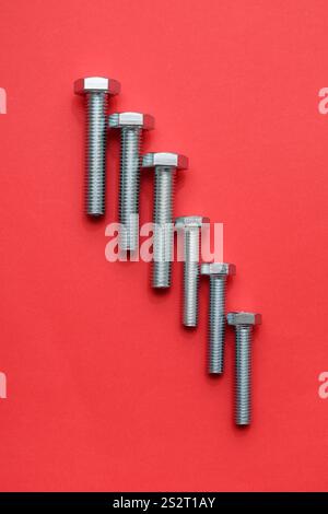 Metal bolts a row background. Chromed screw bolts texture. Steel bolts ...