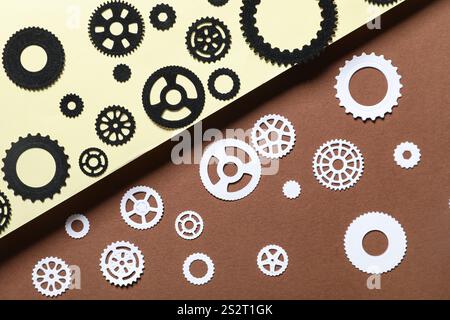 Different paper gears on colorful background Stock Photo - Alamy