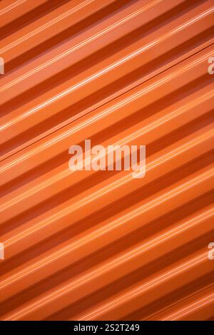 Orange metal sheet siding warehouse construction Stock Photo - Alamy