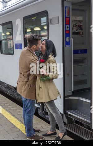 Parr arriving or saying goodbye on a platform at a railway station ...