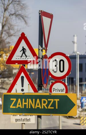 A forest of traffic signs and signs makes it confusing for drivers in ...