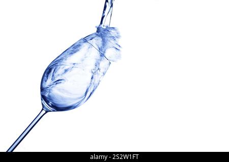 Pure and clean water is poured into a glass. Drinking water in a water ...