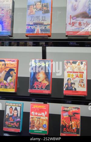 A recreation of a VHS, Beta cassette tape, movie rental store. In a pop ...