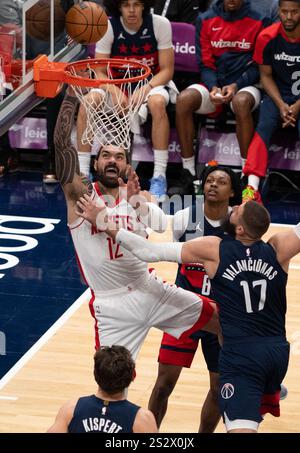 Houston Rockets' Steven Adams (12) goes up for a dunk against the ...