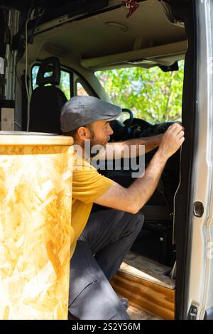 Living and working inside camper van vehicle in travel and digital ...