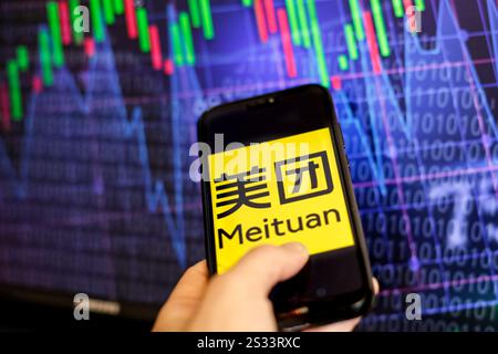 In this photo illustration, the Meituan logo seen displayed on a ...