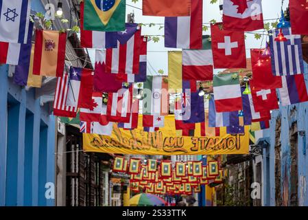 Many countries flags hanging at the streets of Getsemaní Neigborhood ...