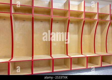 Close up photo of an empty team locker, changing room with traditional ...