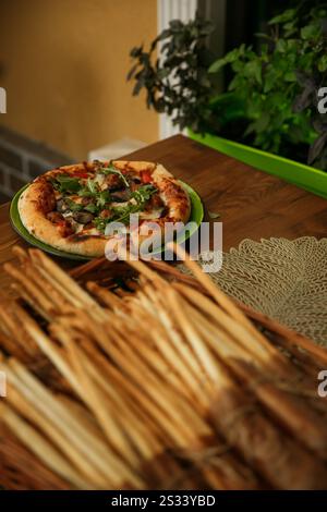 Fresh Italian Grissini Breadsticks served on black background. Dry ...