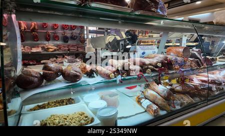 Local residents browse fresh produce inside the Faro Municipal Market ...
