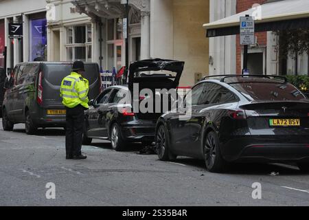 Police set up a cordon as they investigate a suspicious vehicle in ...