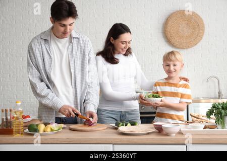 Little boy with his parents cooking Fajita in kitchen Stock Photo - Alamy