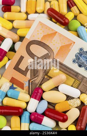 Euro banknotes and tablets Stock Photo - Alamy