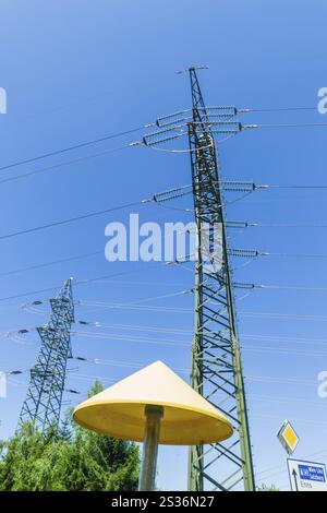 A gas pipeline and an electricity pylon of a high-voltage power line ...