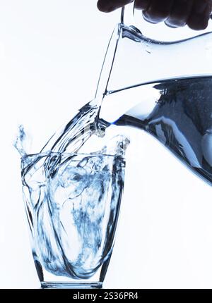 Drinking water is poured into a glass from a faucet in North Vancouver ...