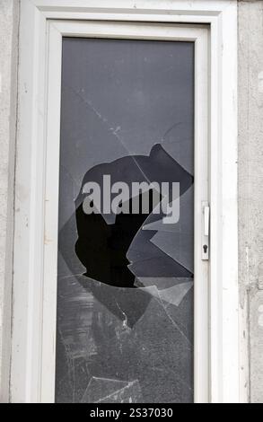 A broken window pane on a patio door Austria Stock Photo - Alamy