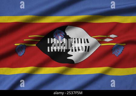 Swaziland flag is depicted on a sports cloth fabric with many folds ...