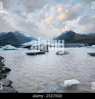 Glacier tongue slides from the Vatnajokull icecap or Vatna Glacier near ...