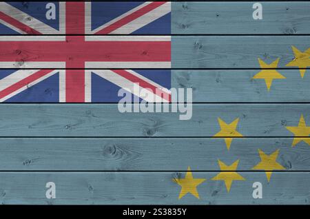 Tuvalu flag depicted in bright paint colors on old wooden wall close up ...