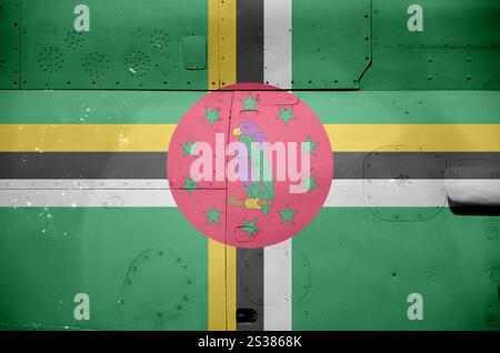 Dominica flag depicted on side part of military armored helicopter ...