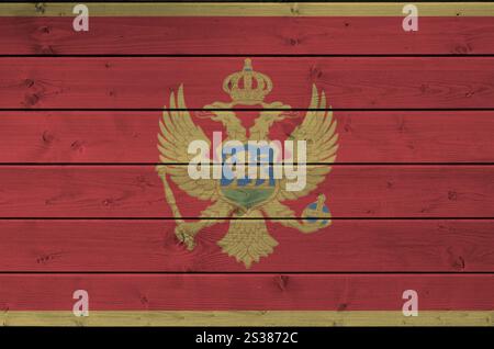 Montenegro flag depicted in bright paint colors on old wooden wall ...