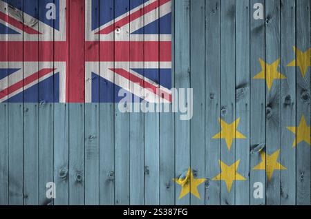 Tuvalu flag depicted in bright paint colors on old wooden wall close up ...