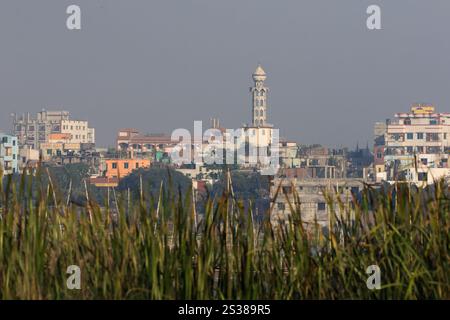 Beautiful view of Dhaka city with buildings and natural grass field ...
